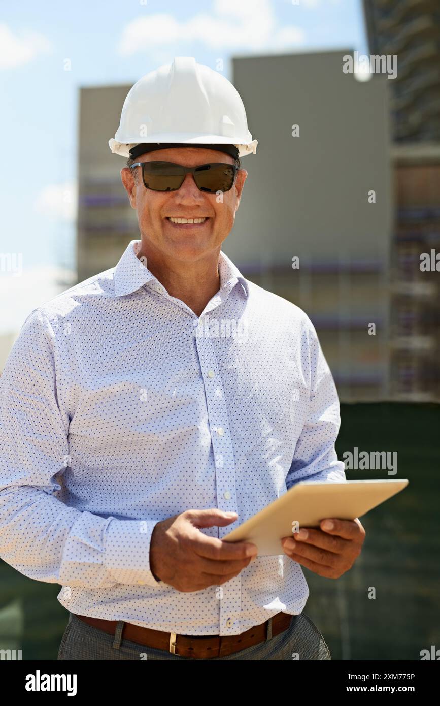 Portrait, smile and man with tablet, architecture and hard hat with ...