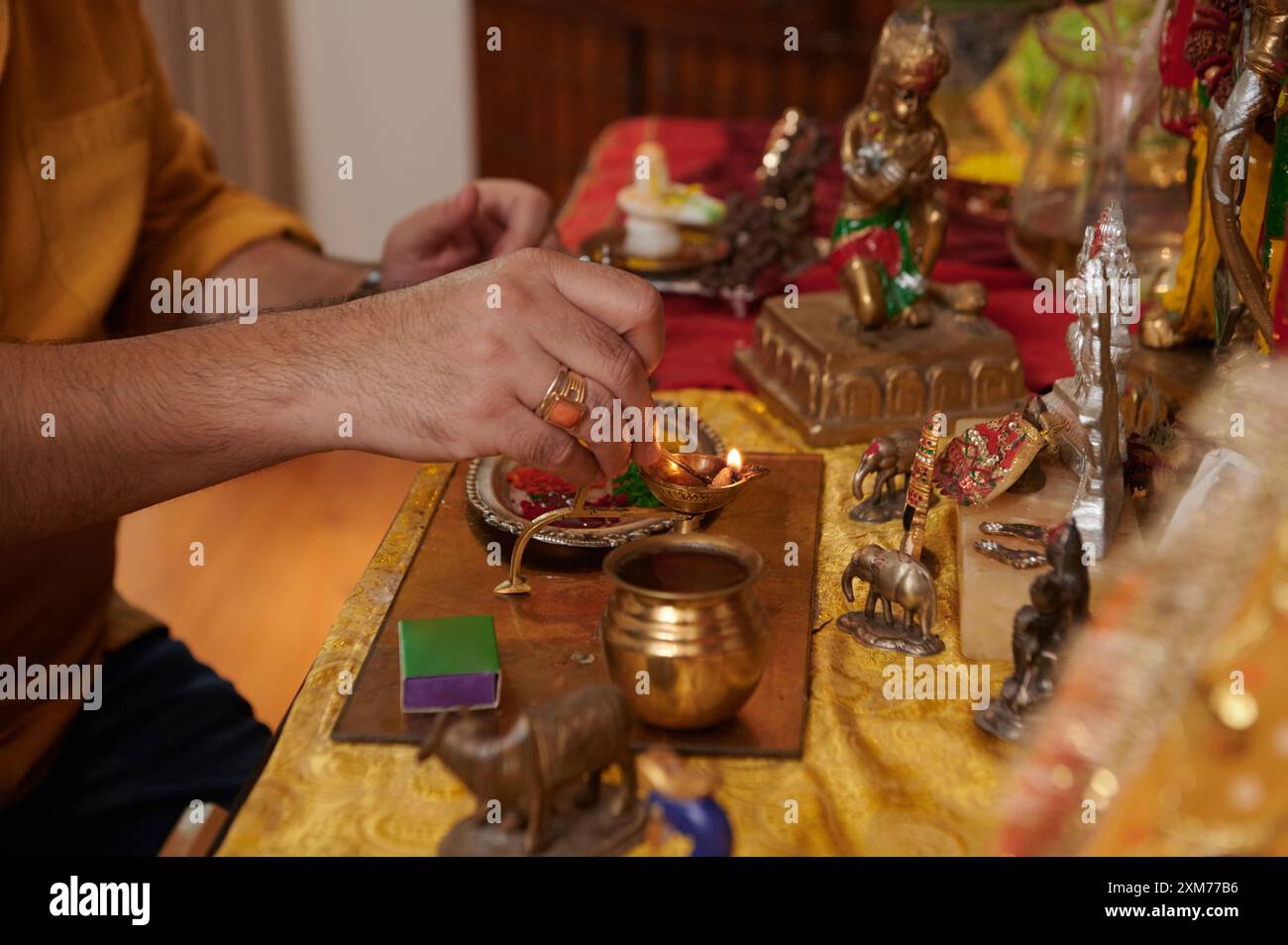 Man Lightning Candles At Altar Stock Photo - Alamy