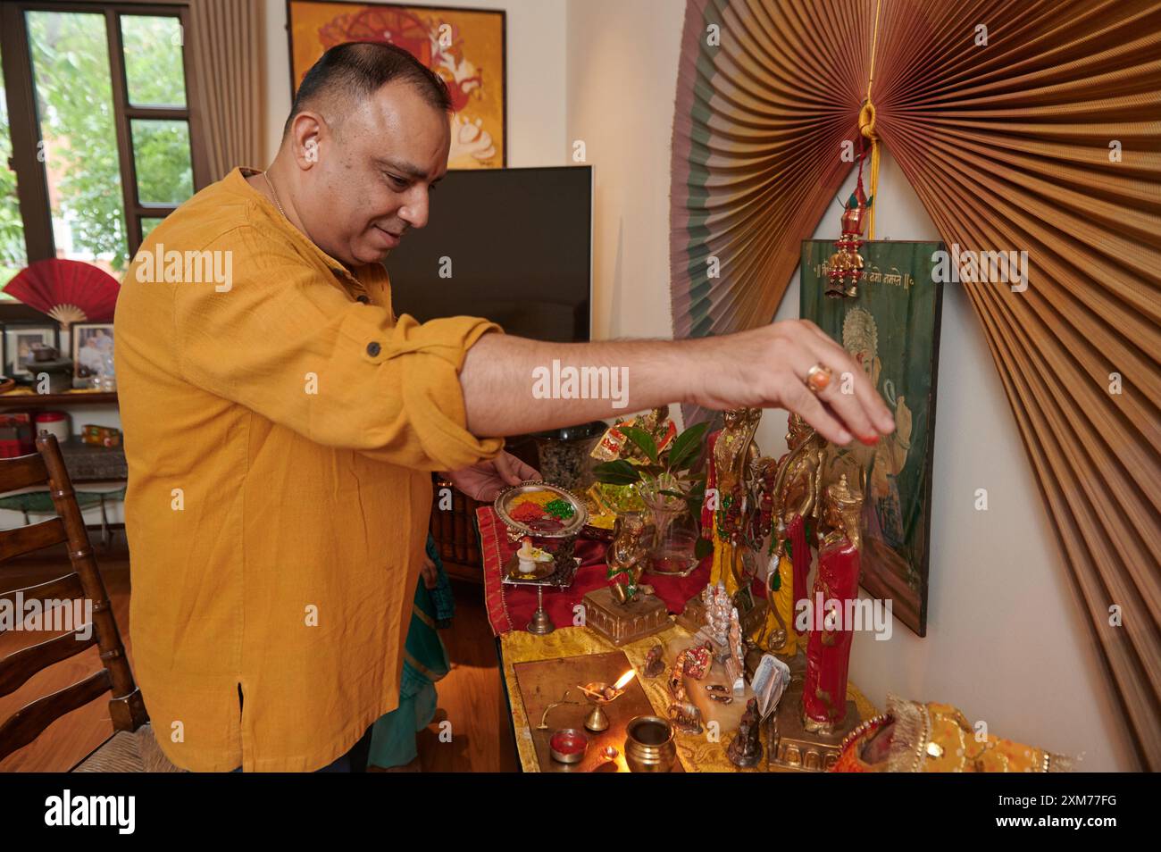 Man Praying At Altar At Home Stock Photo - Alamy