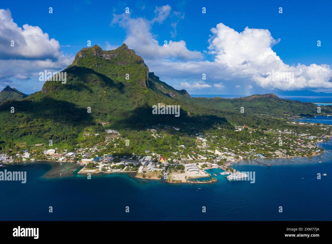 Aerial view of the lagoon of Bora Bora with the town of Vaitape and ...