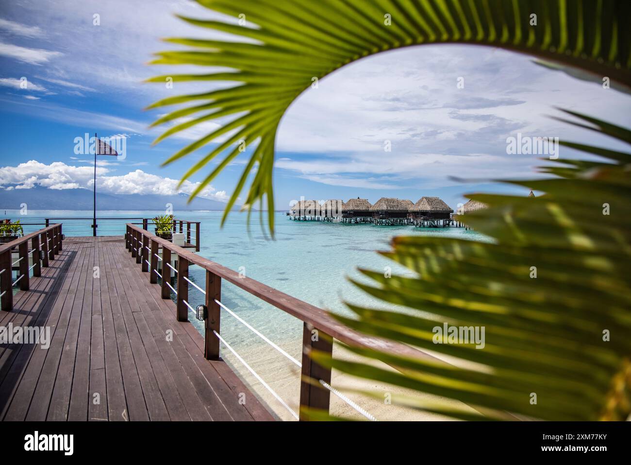 Pier and overwater bungalows of Sofitel Ia Ora Beach Resort, seen ...