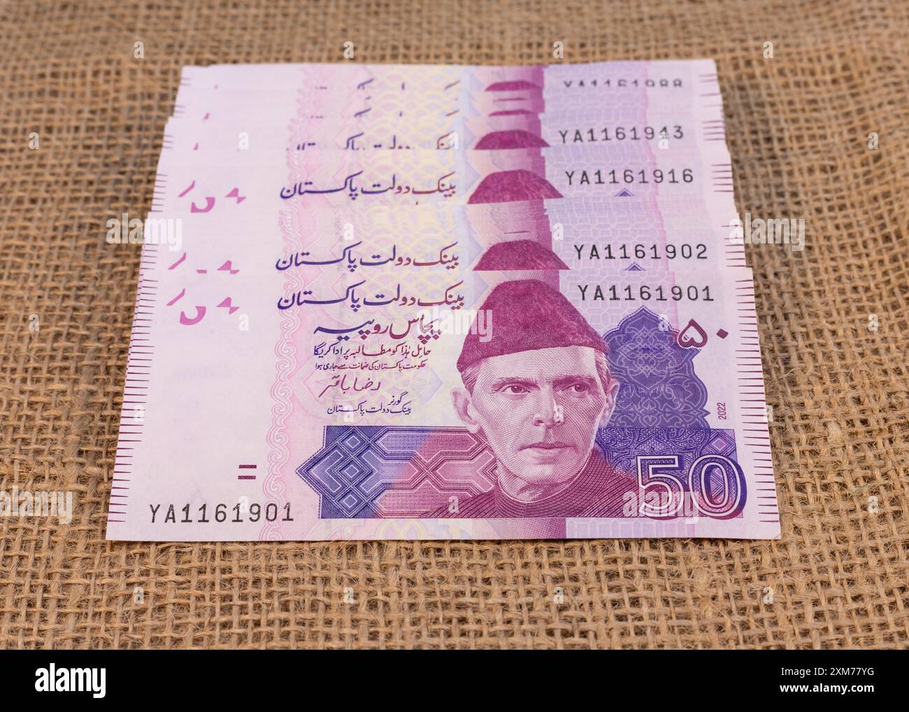 Pakistan fifty rupees notes on a burlap background Stock Photo - Alamy