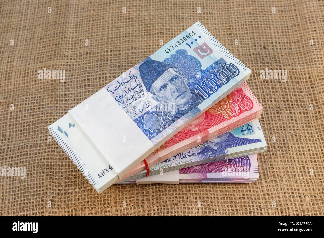 Pakistan different value currency notes bundle stacked on jute ...