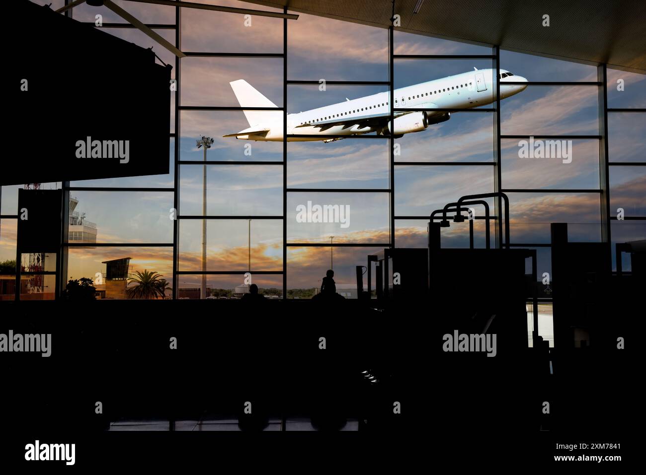 Air travel A plane taking off as passengers watch from the airport ...
