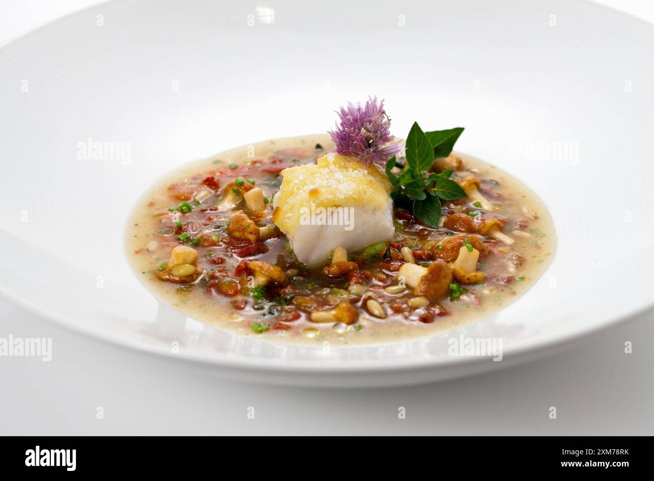 Black monkfish with a sea salt crust in a potato and chanterelle sauce ...