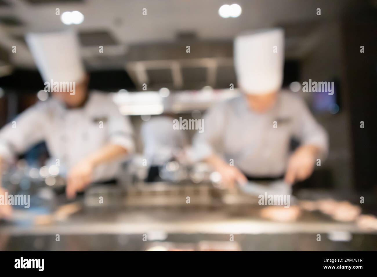Chef cooking in restaurant kitchen blurred defocused background Stock ...