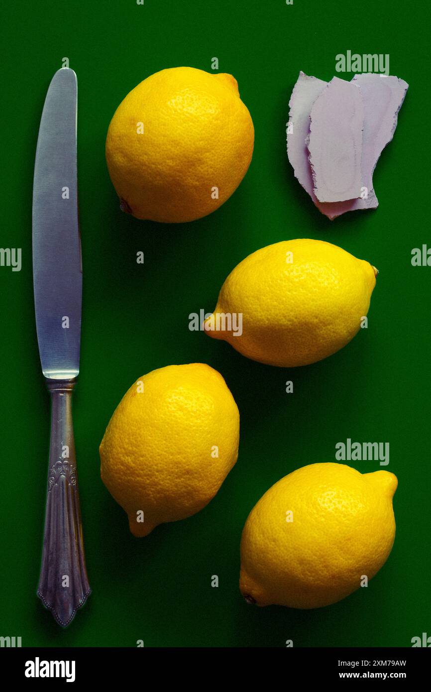 Four whole lemons with knife Stock Photo - Alamy