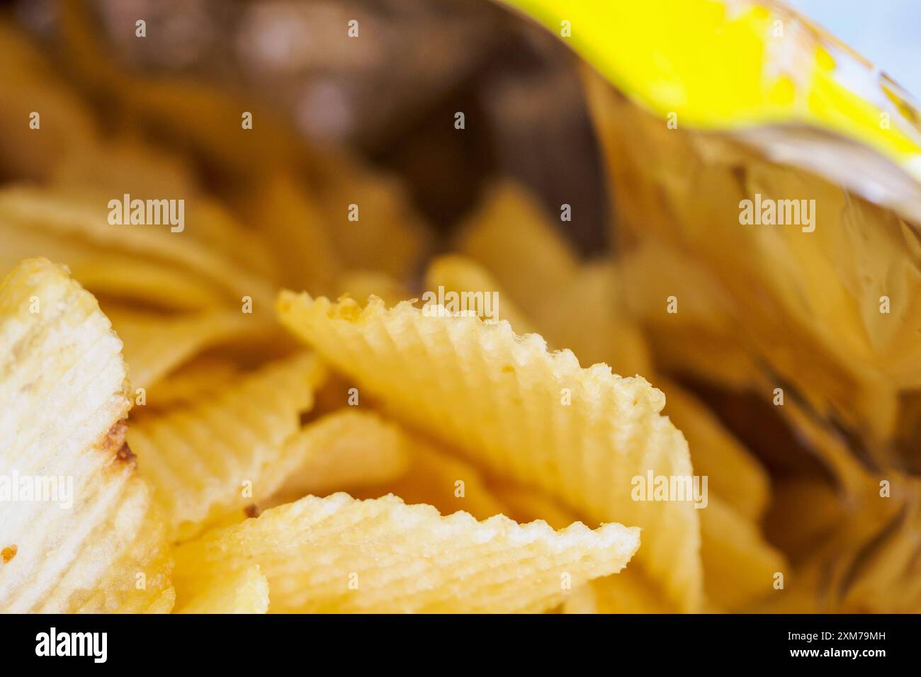 Potato chips in open snack bag close up Stock Photo - Alamy
