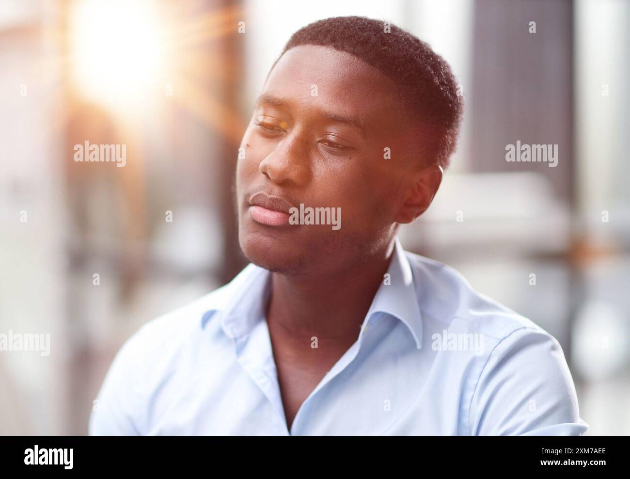 Thoughtful black man in eyeglasses stack with hard task, looking at ...