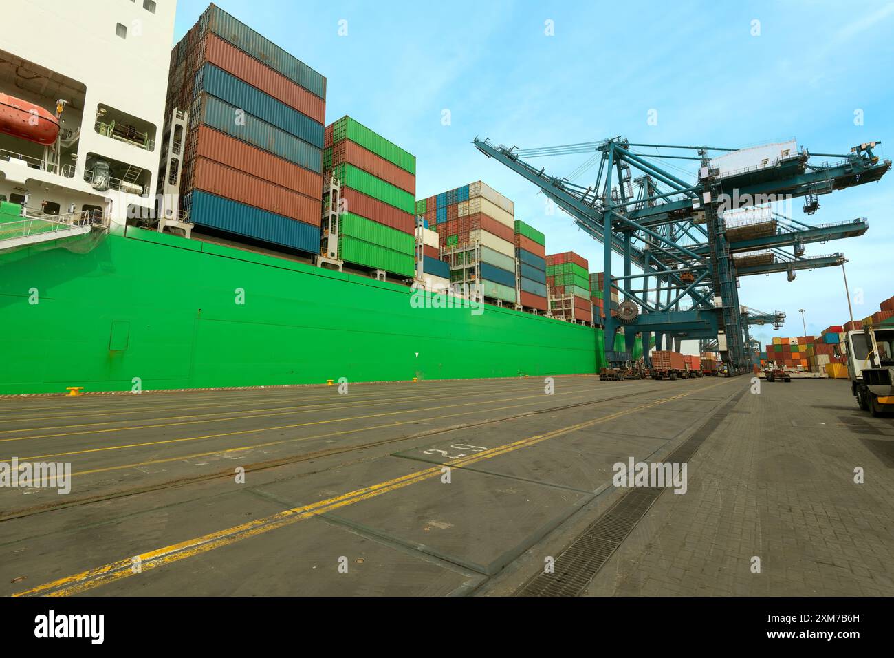 Cargo ship being loaded with containers at the port of San Antonio in ...