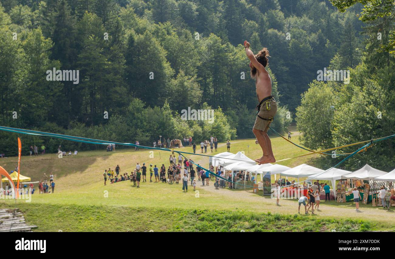 Serina Italy July 21, 2024: Tightrope walker walking on a rope ...