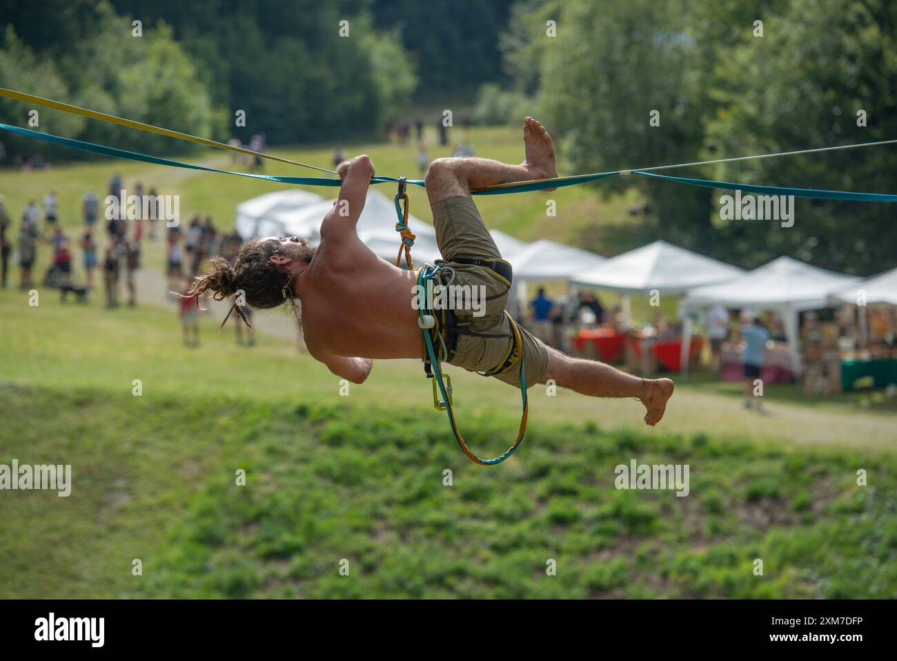Serina Italy July 21, 2024: Tightrope walker walking on a rope ...
