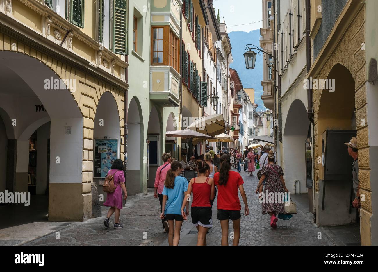 Merano, South Tyrol, Italy - Passers-by stroll through the Laubengasse ...