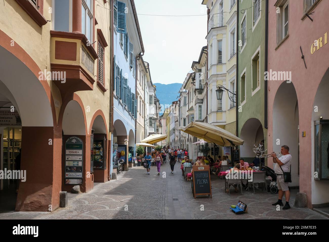 Merano, South Tyrol, Italy - Passers-by stroll through the Laubengasse ...