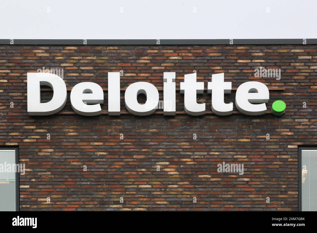 Deloitte logo on a wall. Deloitte is one of the Big Four accounting ...