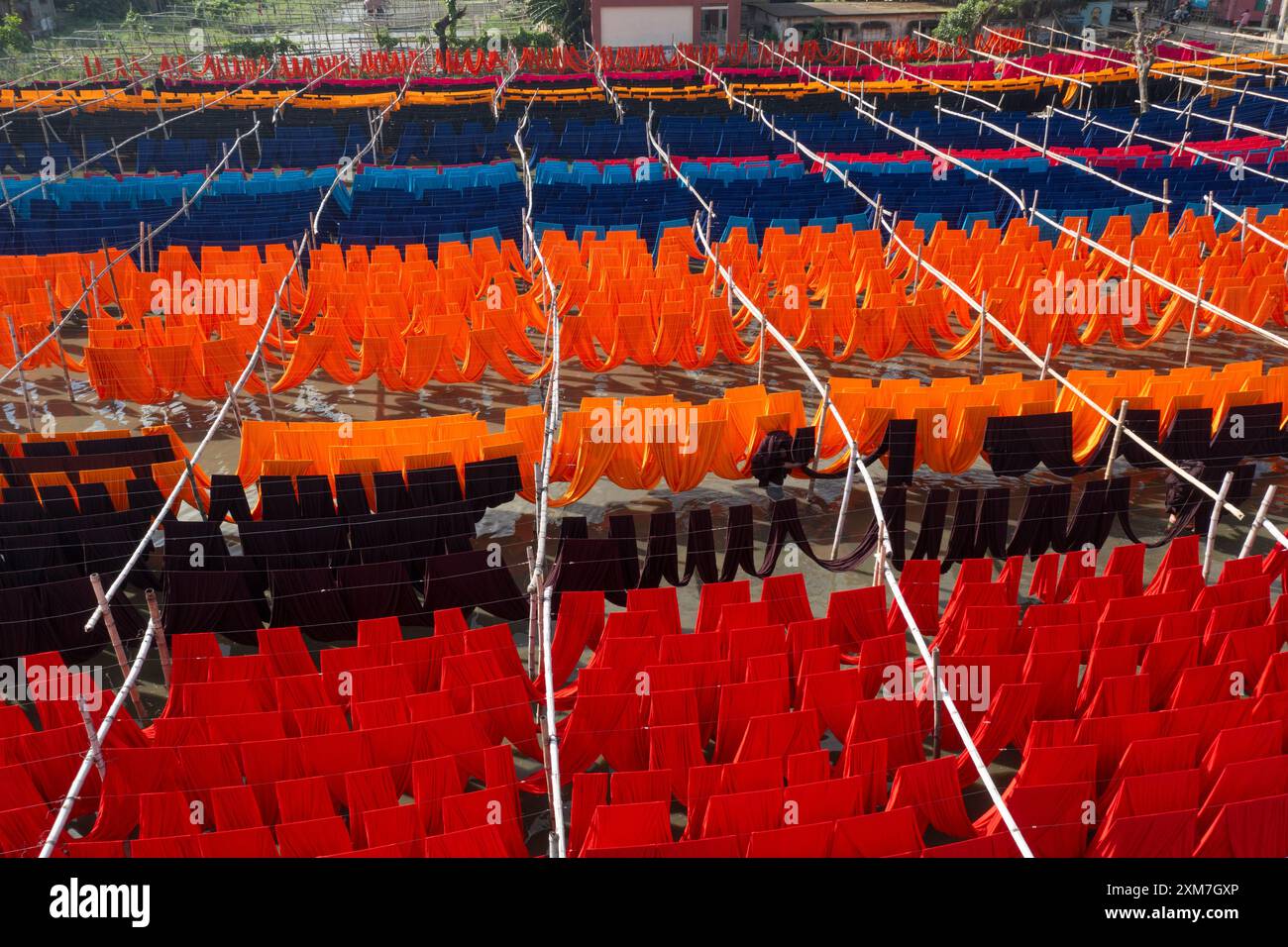Workers are busy drying dyed clothes in various dyeing factories at ...