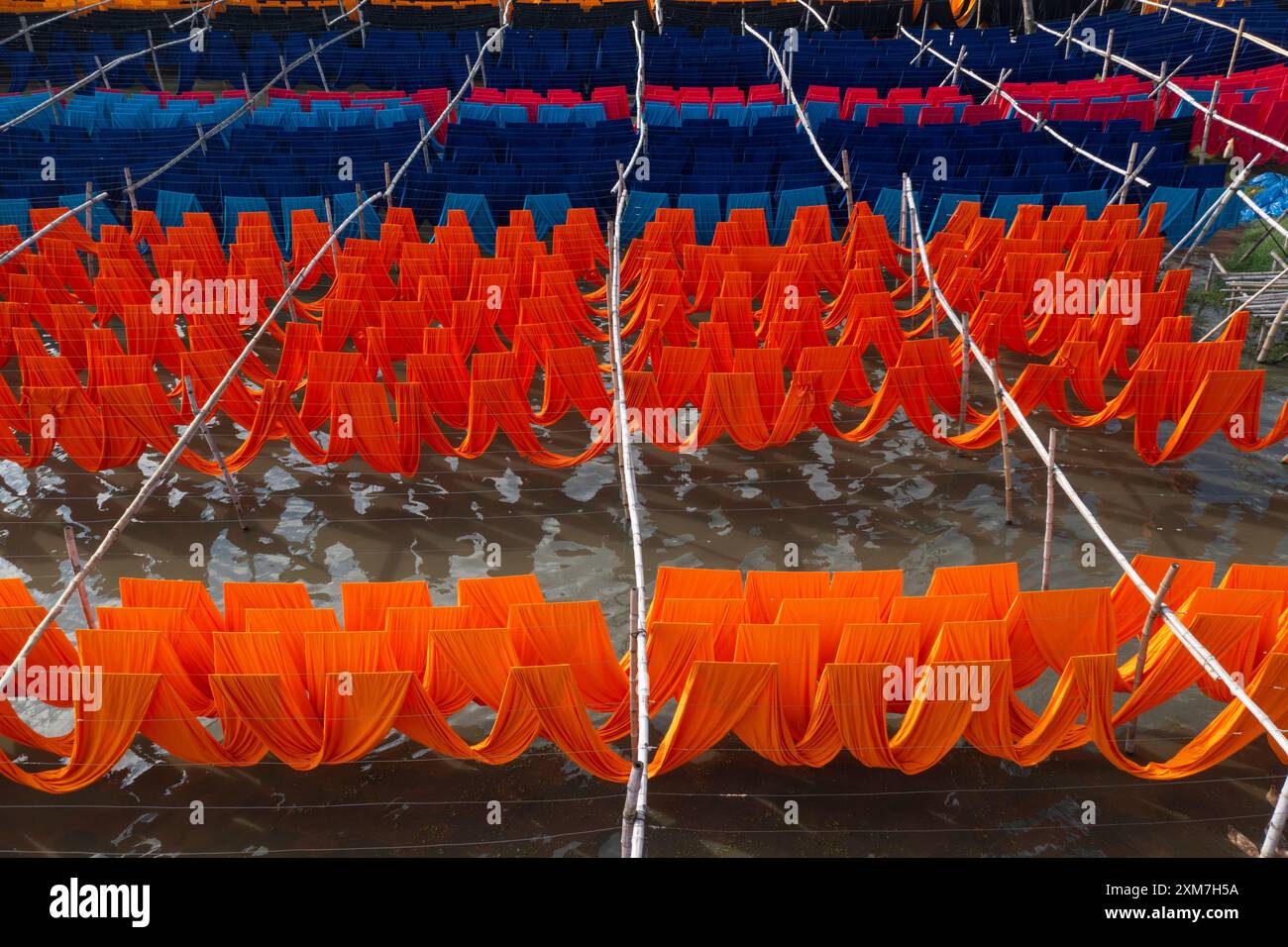 Workers are busy drying dyed clothes in various dyeing factories at ...