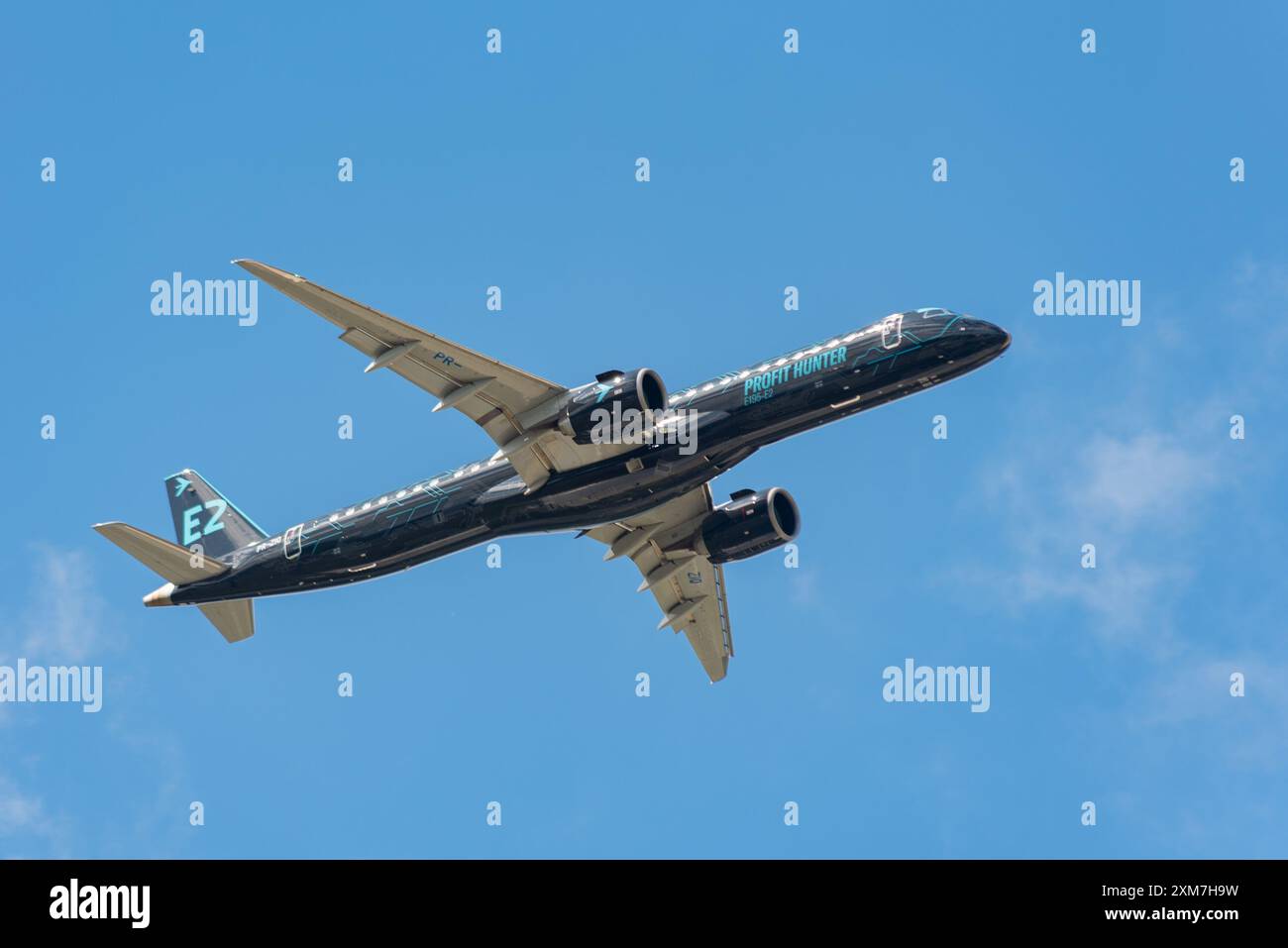 Embraer E195-E2 airliner jet plane named Profit Hunter flying at the ...