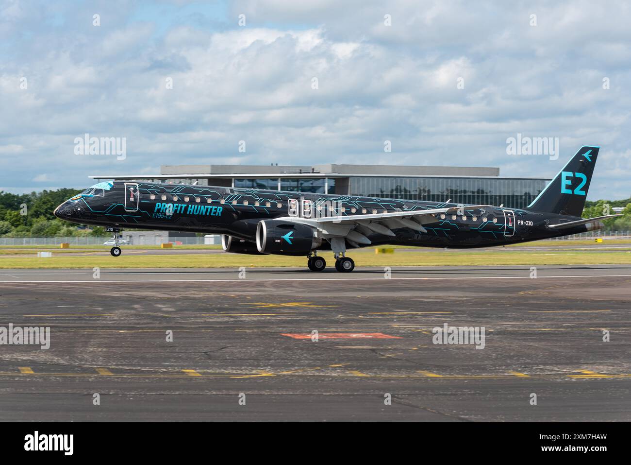 Embraer E195-E2 airliner named Profit Hunter landing at the Farnborough ...