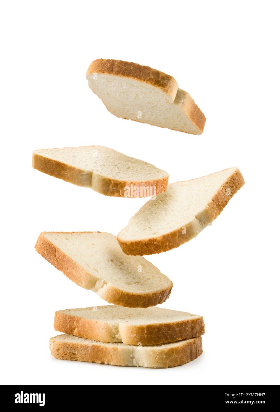 Slices of white bread falling on white background Stock Photo - Alamy