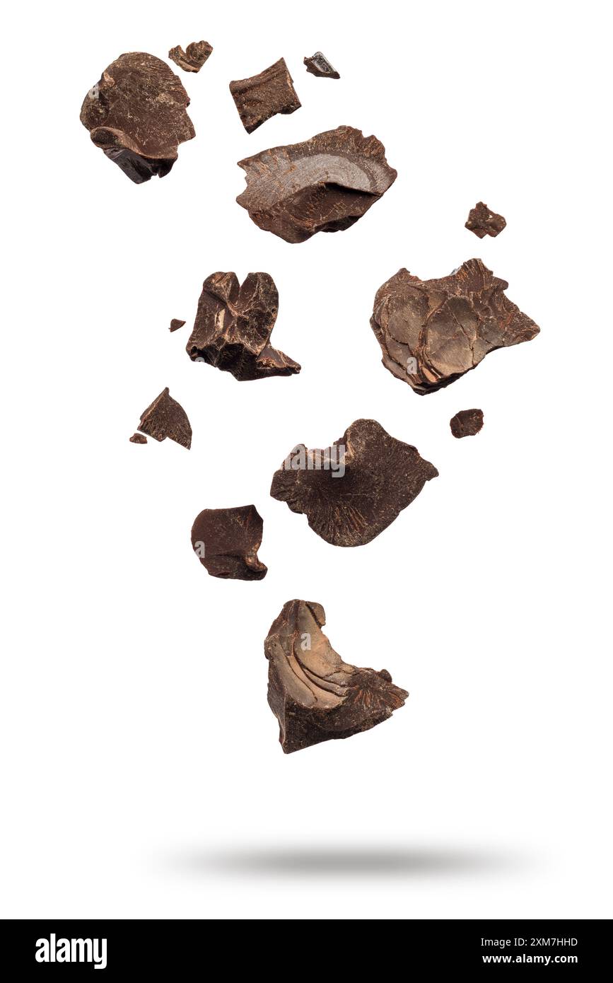Dark chocolate flakes falling, isolated on white background Stock Photo ...