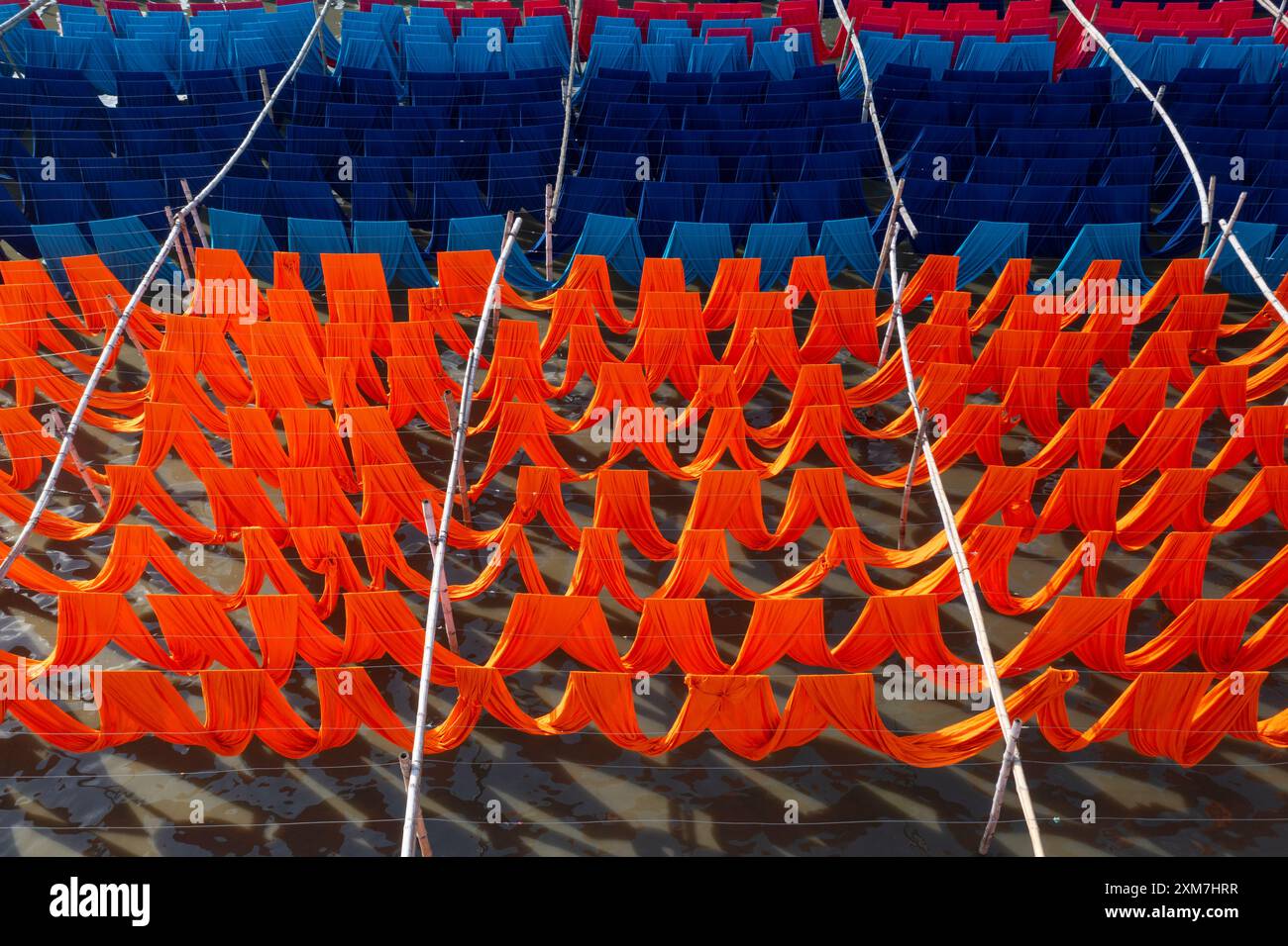 Workers are busy drying dyed clothes in various dyeing factories at ...