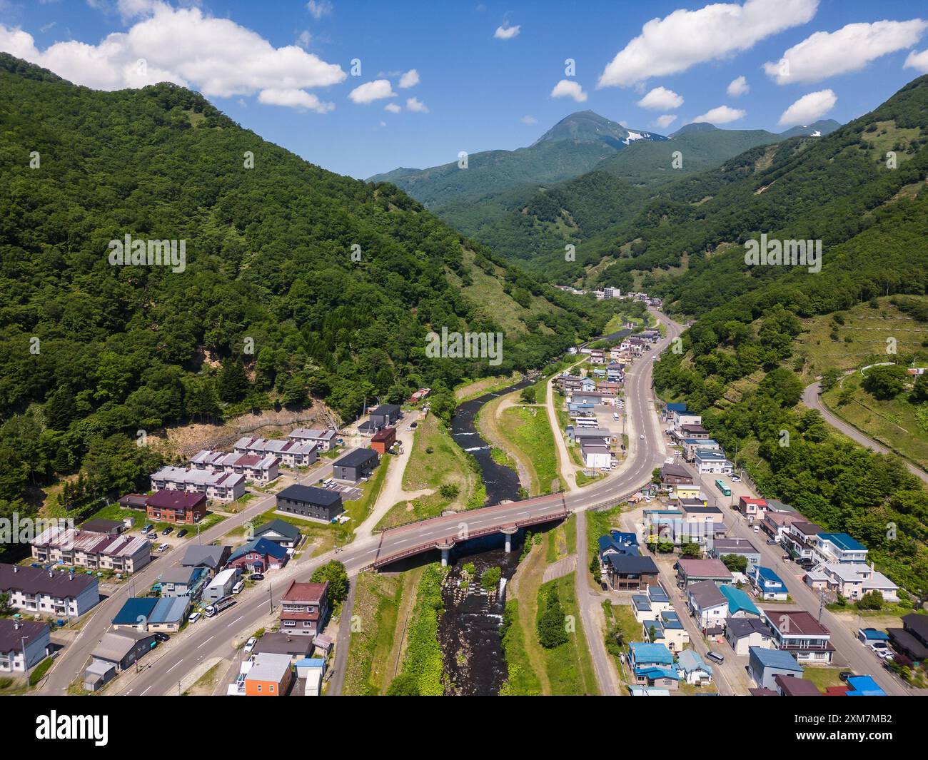 Rausu, Hokkaido: Aerial view of the Rausu town and volcano in the ...
