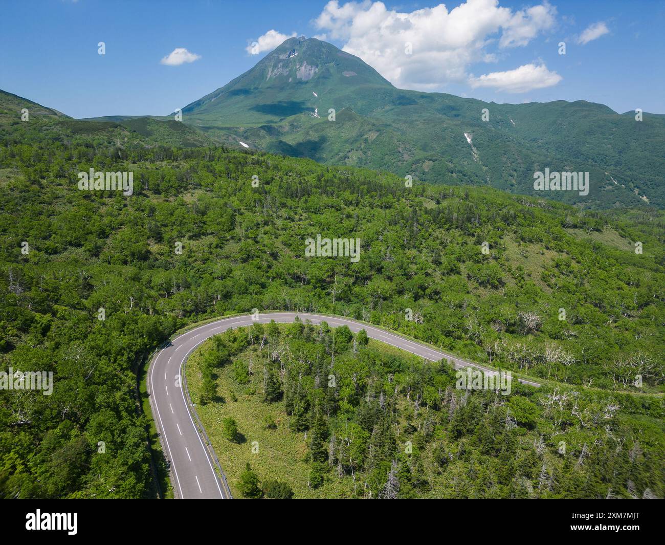 Rausu, Hokkaido: Sharp curve along the the Shiretoko pass road with the ...