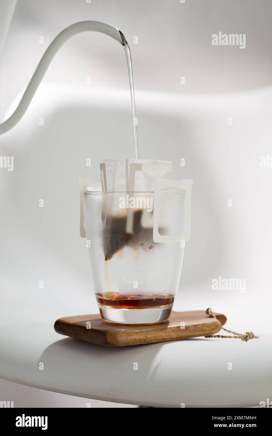 A Drip Bag methodically filters water through Coffee grounds ...