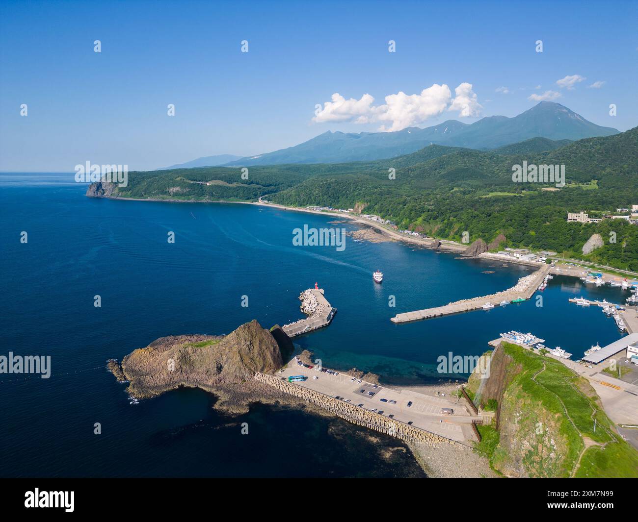 Utoro, Japan: Aerial drone view of a tour boat that sails back to the ...