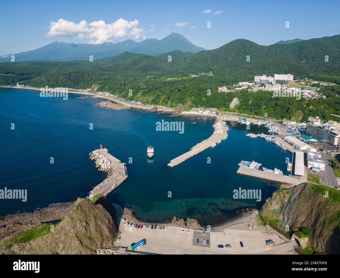 Utoro, Japan: Aerial drone view of a tour boat that sails back to the ...