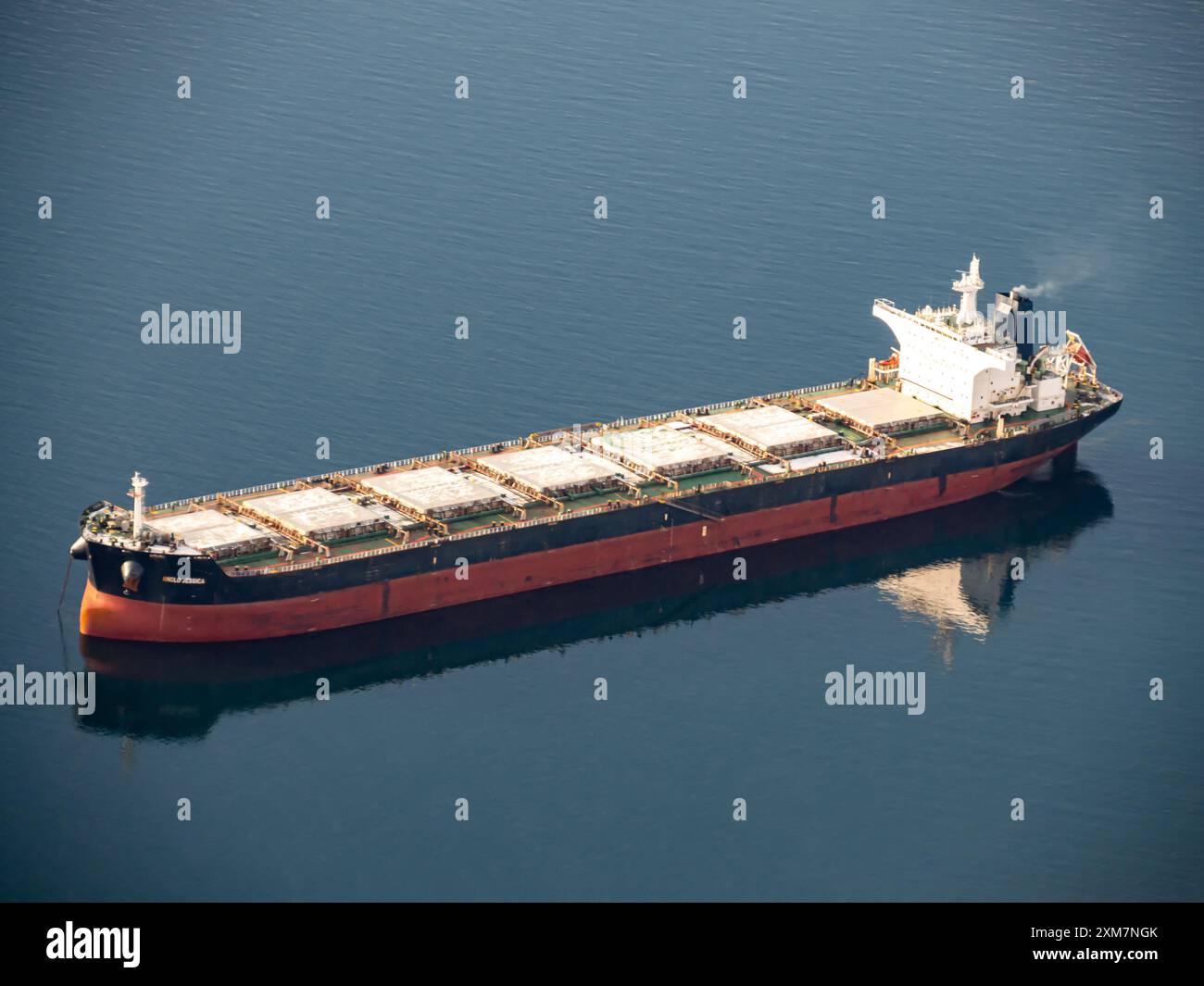 Aerial view of a cargo ship approaching port terminal, Narvik, Norway ...