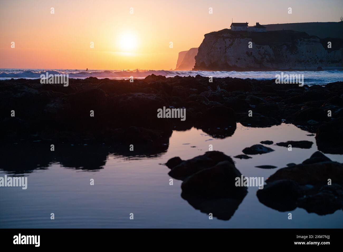 Freshwater Bay in a low sun with vibrant colours over the sea water and ...