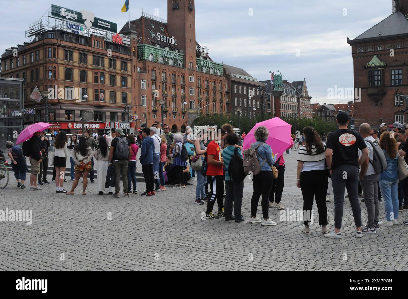 Copenhagen/ Denmark/26 July 2024/Pedestrain guide tour tourists in ...