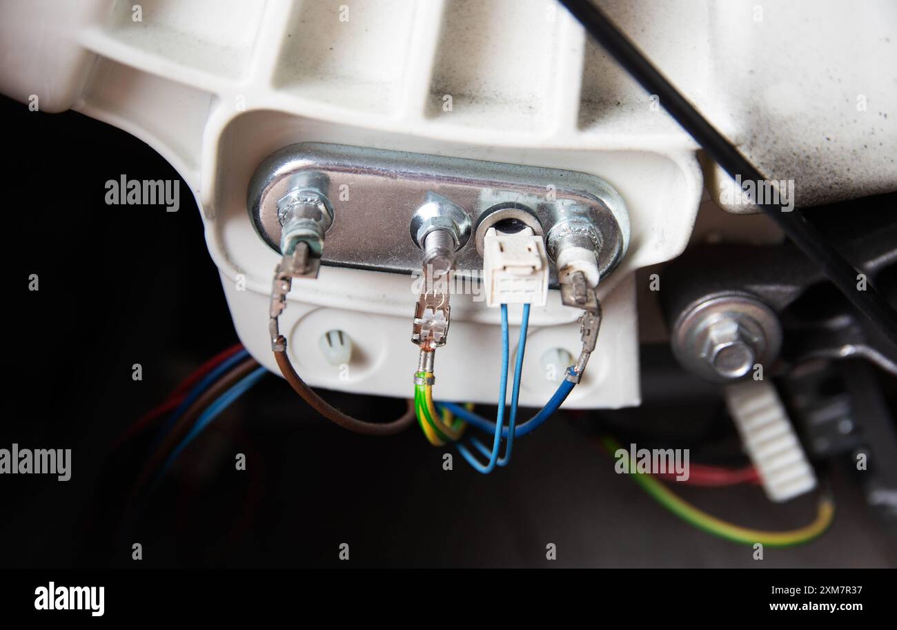 An electric heating element with a thermostat is connected with ...