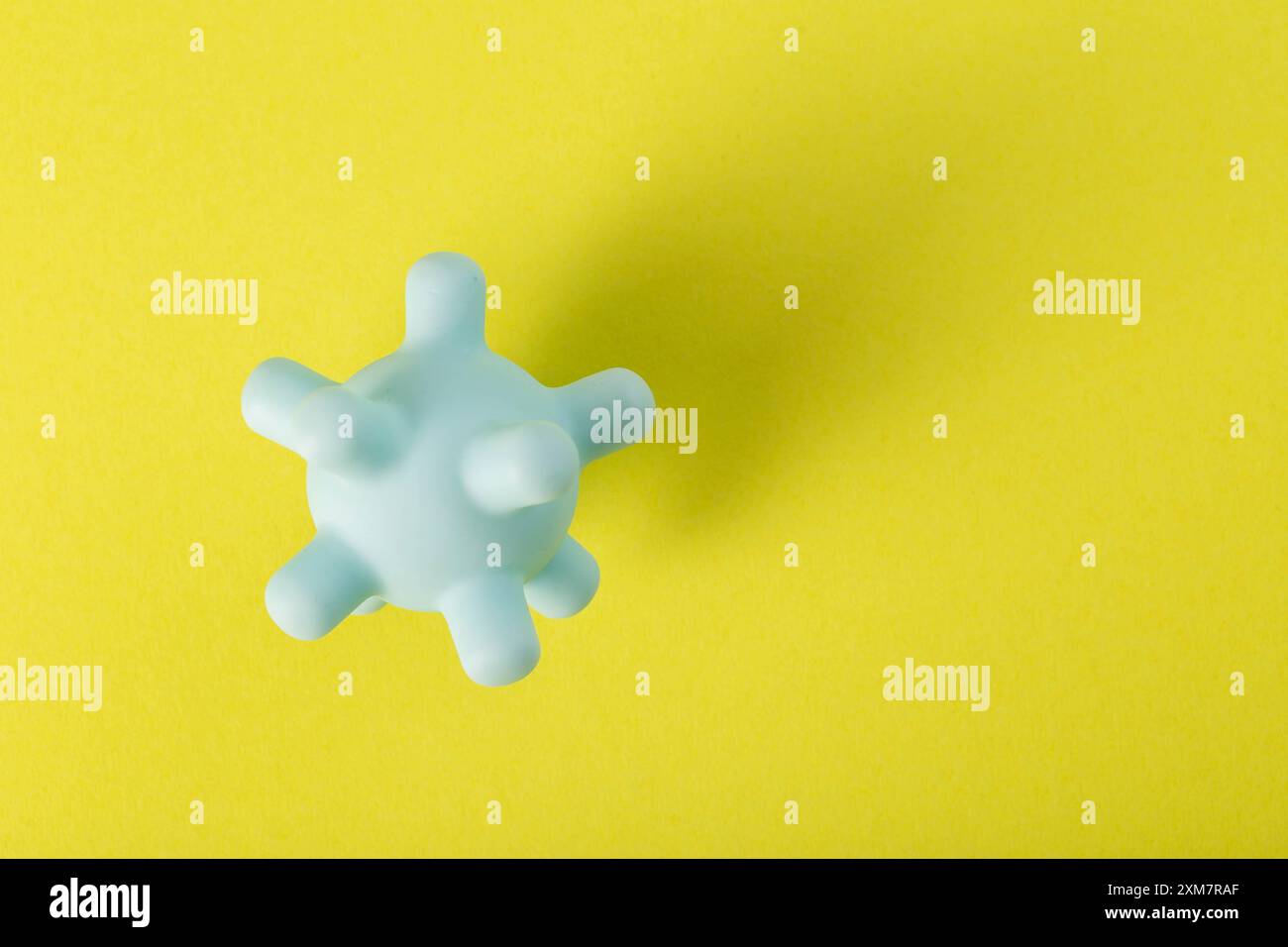 Blue mockup of oral virus and bacteria on a yellow background. The ...