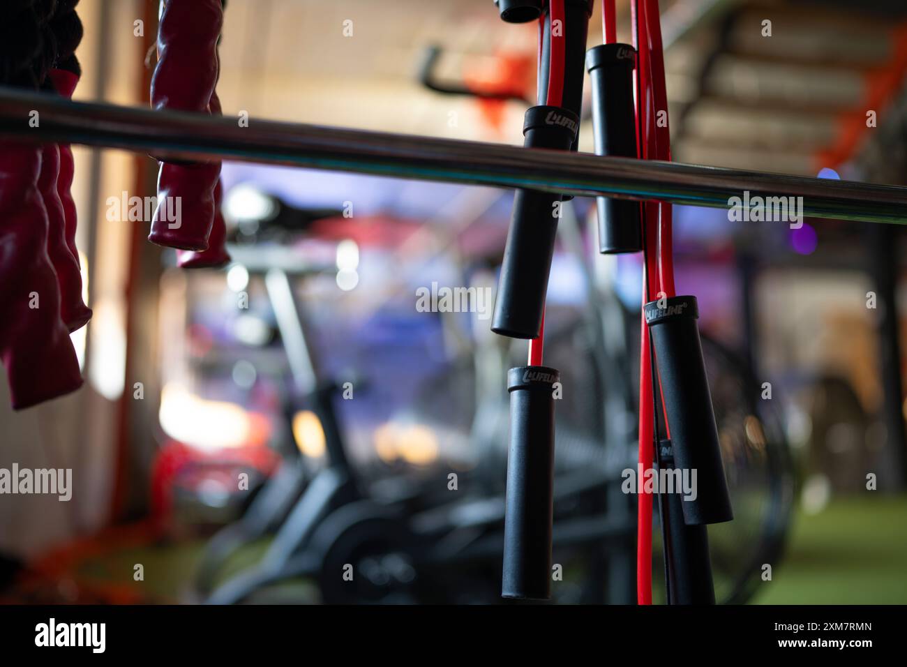 Indoor performance fitness studio lifting rack closeup with jump ropes ...