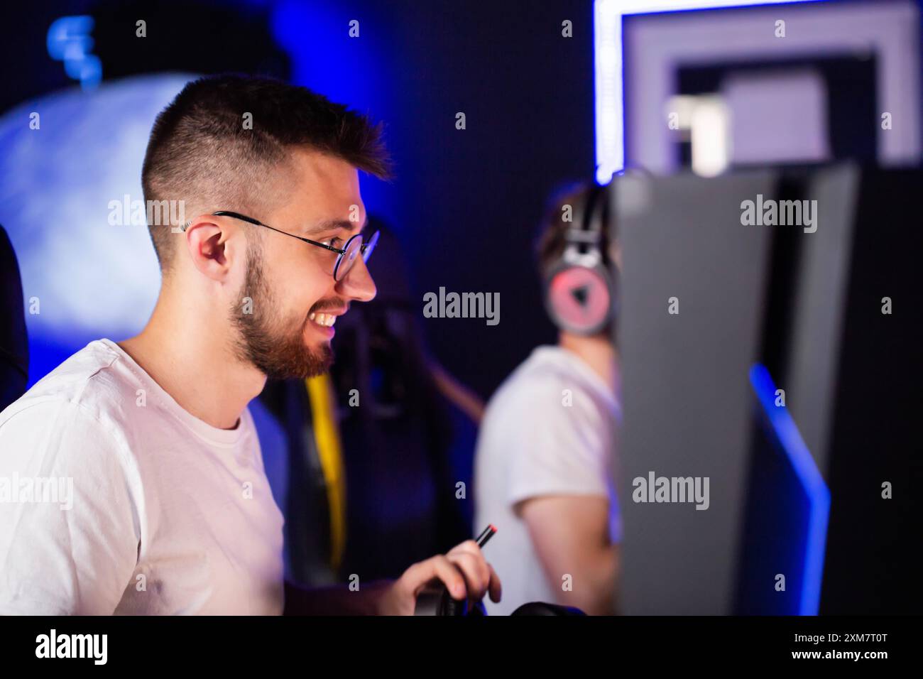 Man in glasses plays computer hi-res stock photography and images - Alamy