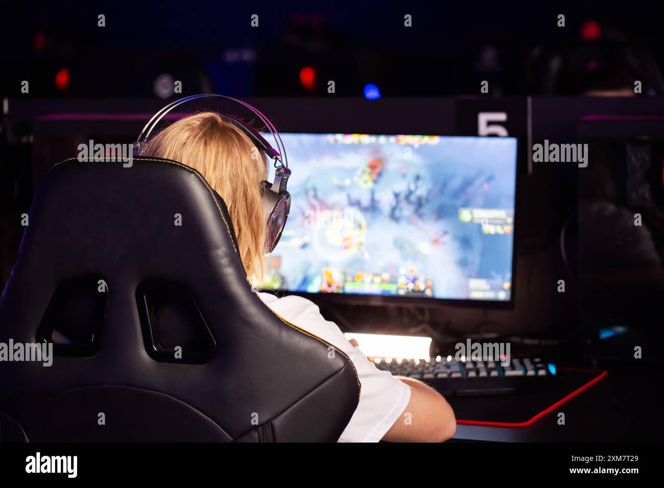 E-sport tournament Gamer in headset plays video game on PC Computer ...