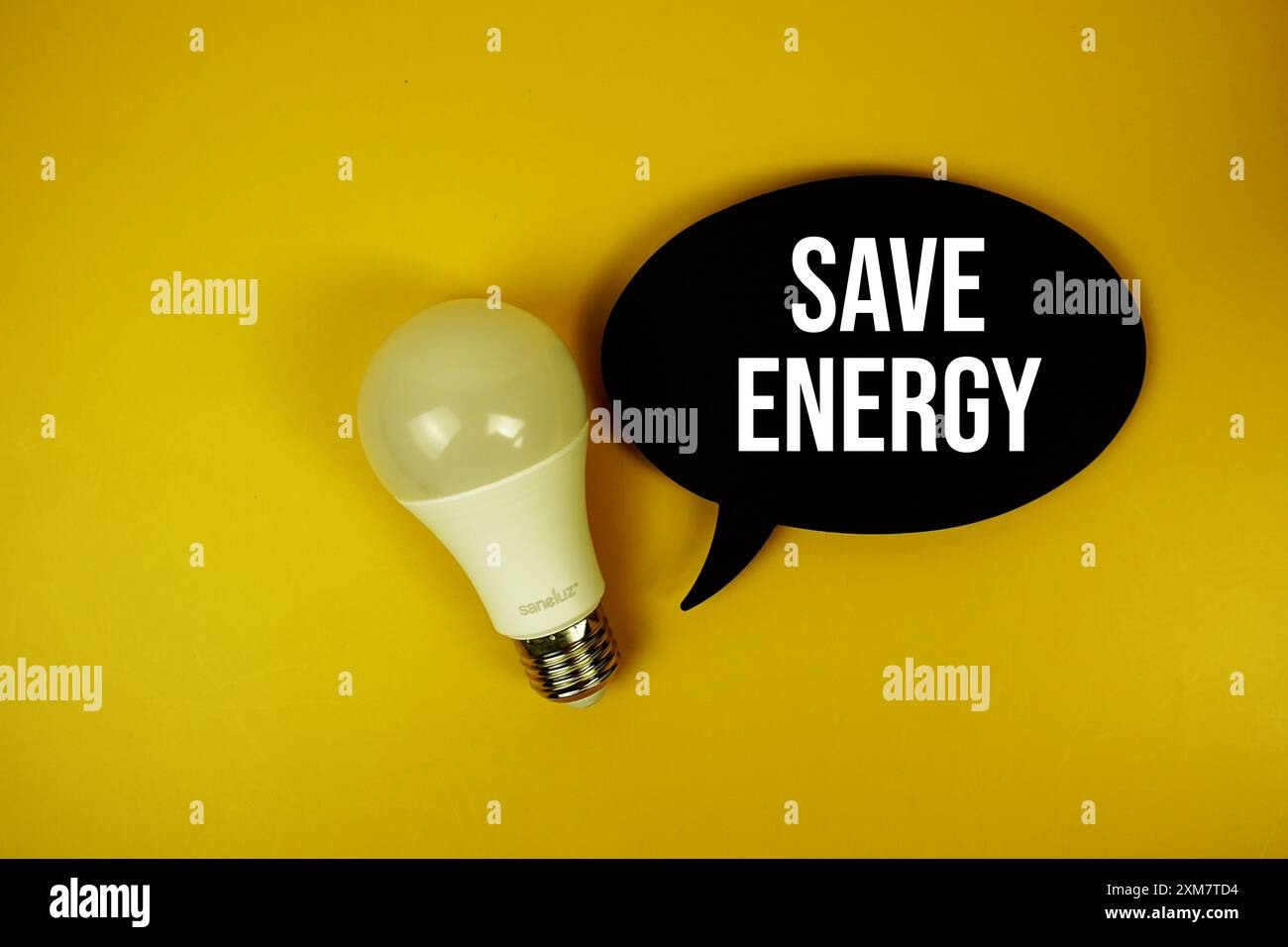 Save Energy text on speech bubble with light bulb top view on yellow ...