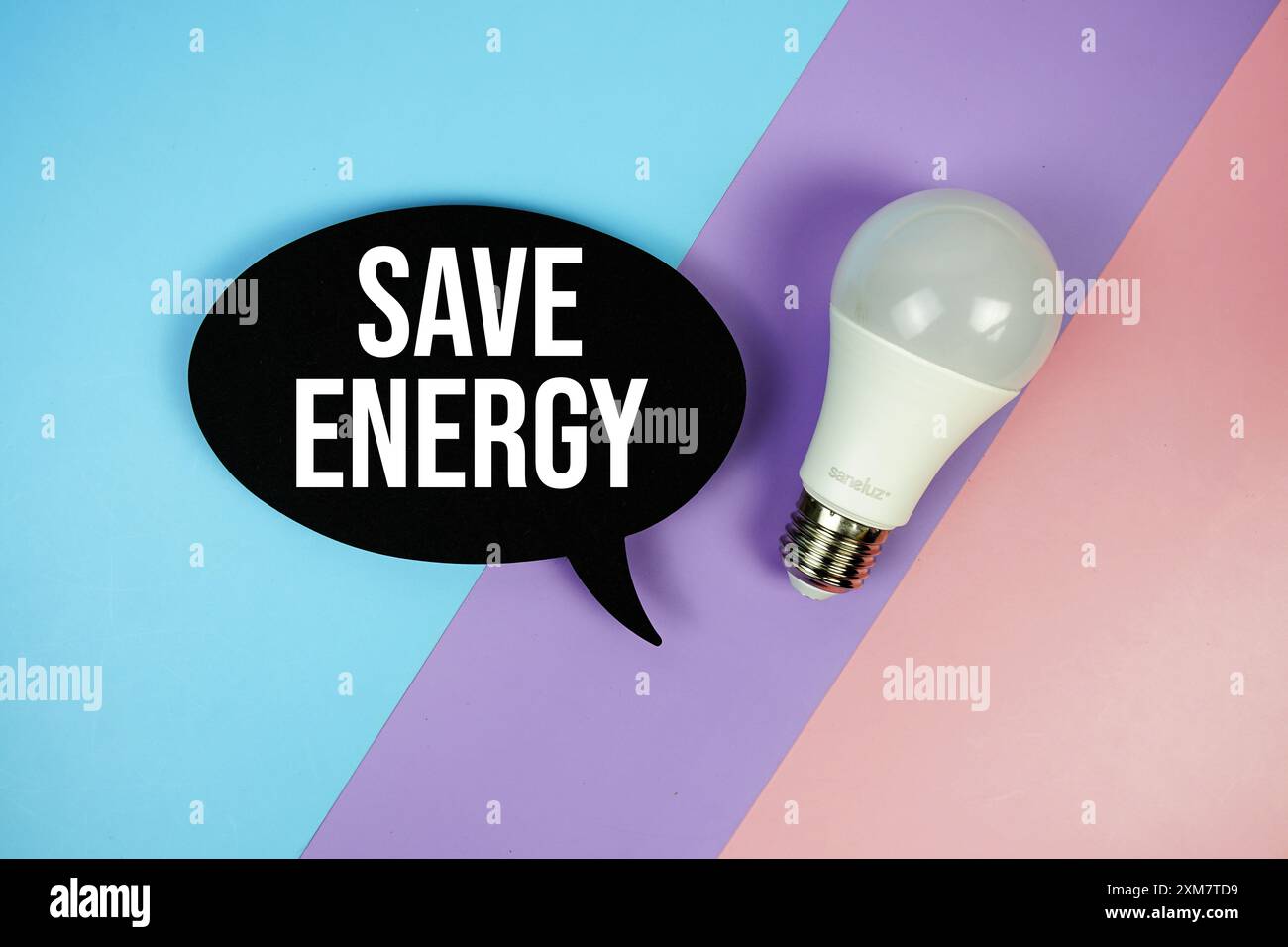 Save Energy text on speech bubble with light bulb top view on blue ...