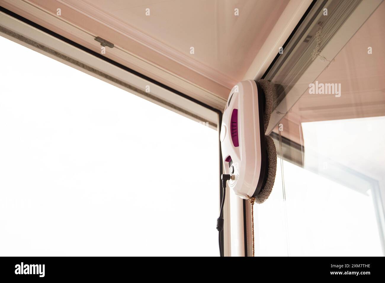 Automatic vacuum robot window washer washes glass from dirt. Modern ...