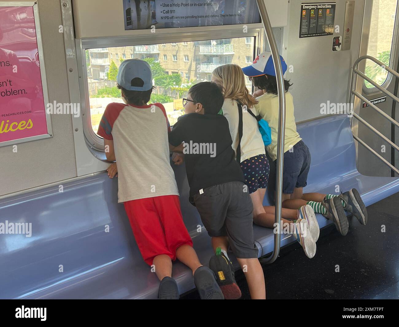 KIds look out above ground subway window on their way to Coney Island ...
