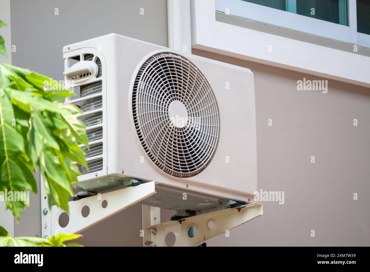 Air conditioner compressor outdoor unit installed outside the house ...