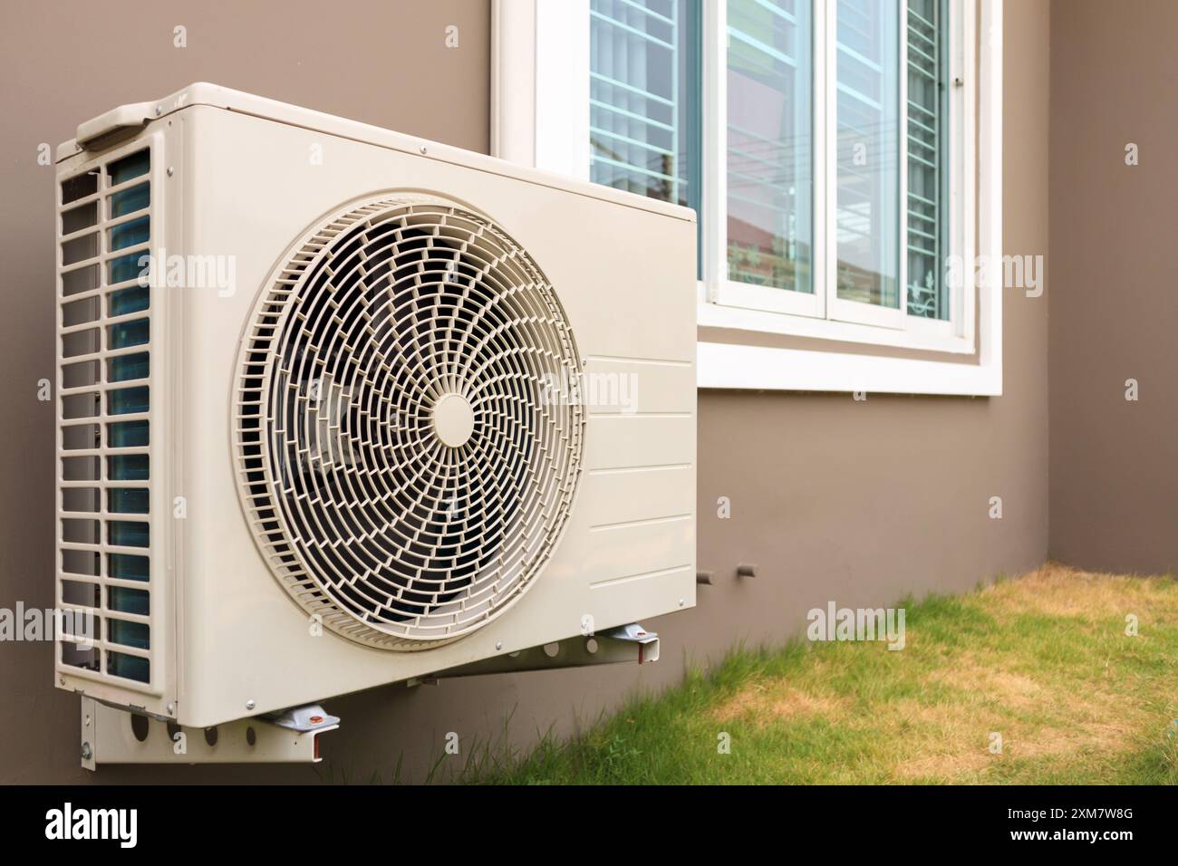 Air conditioner compressor outdoor unit installed outside the house ...