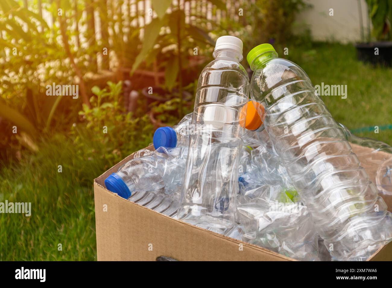 plastic bottles in brown recycle garbage box Stock Photo - Alamy