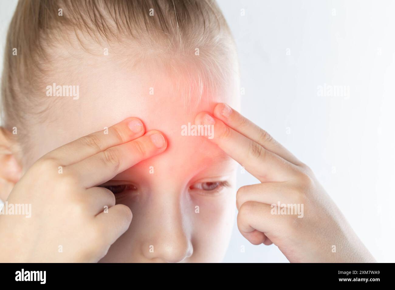 The girl holds her forehead with her hands, pain in her head. The ...