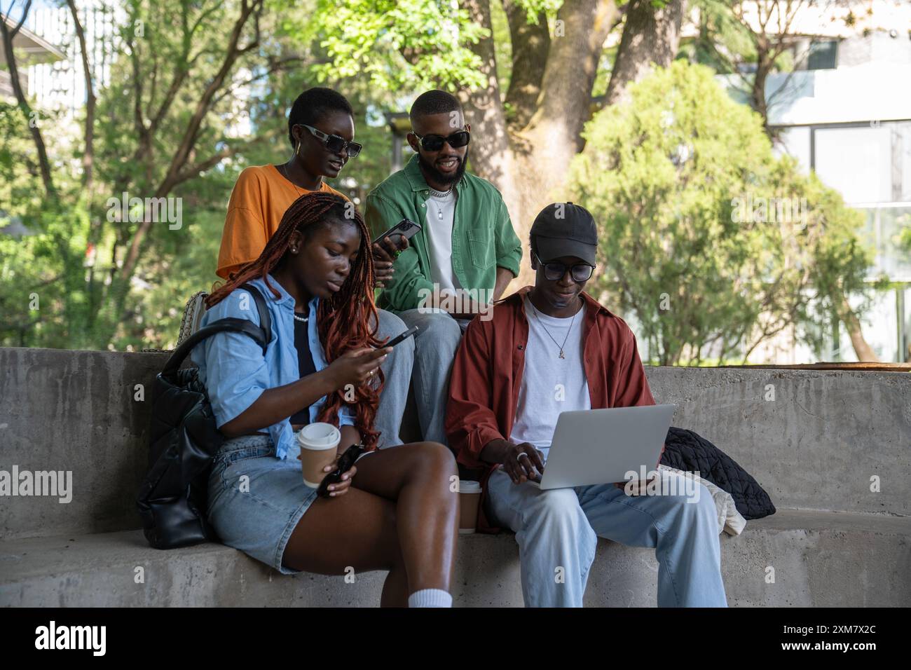 Meeting of peaceful African friends, classmates relaxing outside ...