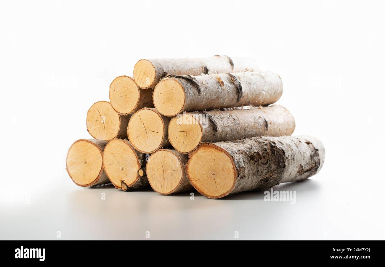 Stack of birch firewood on a white background isolate. Material for ...