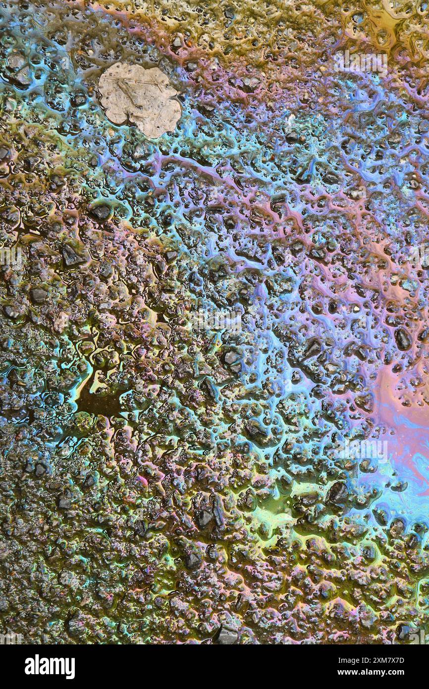 Colorful car's lubricating oil on the ground after the rain Stock Photo ...